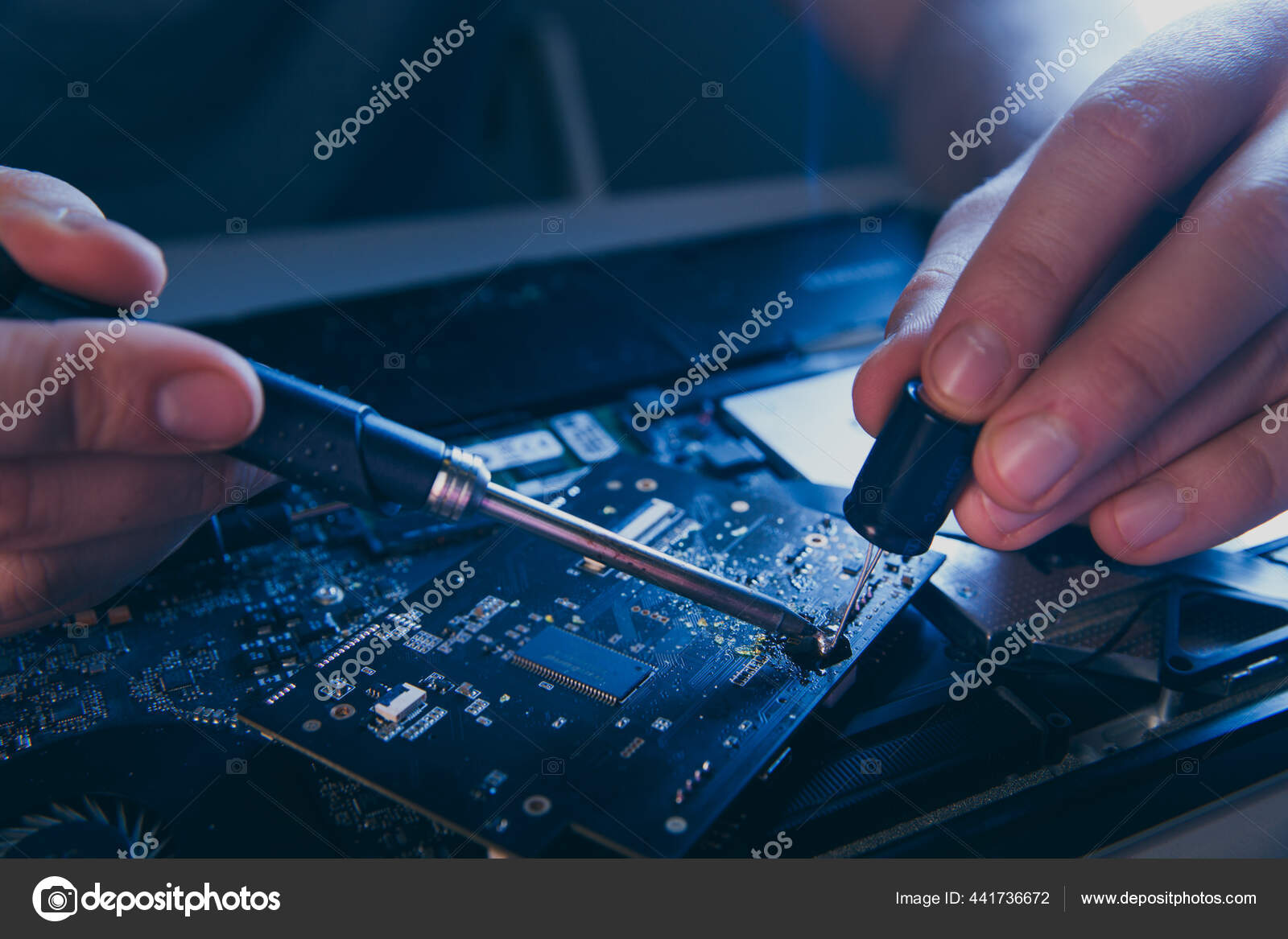 PC technology .Computer repair shop. Engineer performing laptop ...