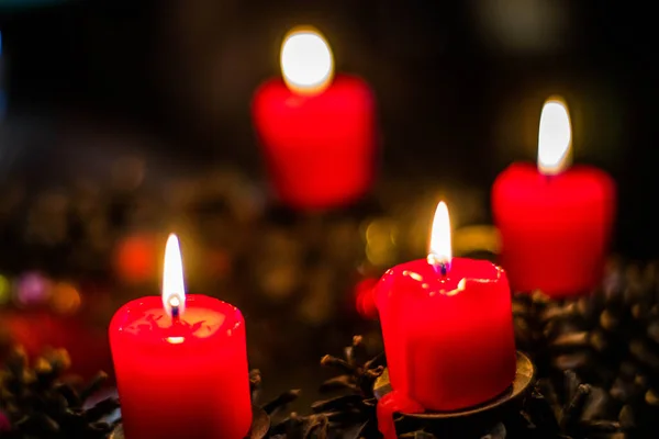Advent candles glow and mark the celebration of Christmas/Advent Wreath ...