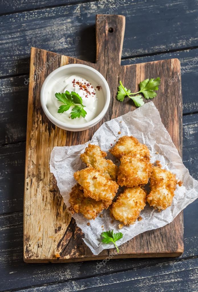 Crispy fried fish on a wooden rustic board ⬇ Stock Photo, Image by ...
