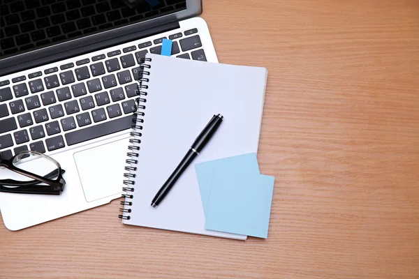 Office table with laptop, notepad. View from above with copy space ...