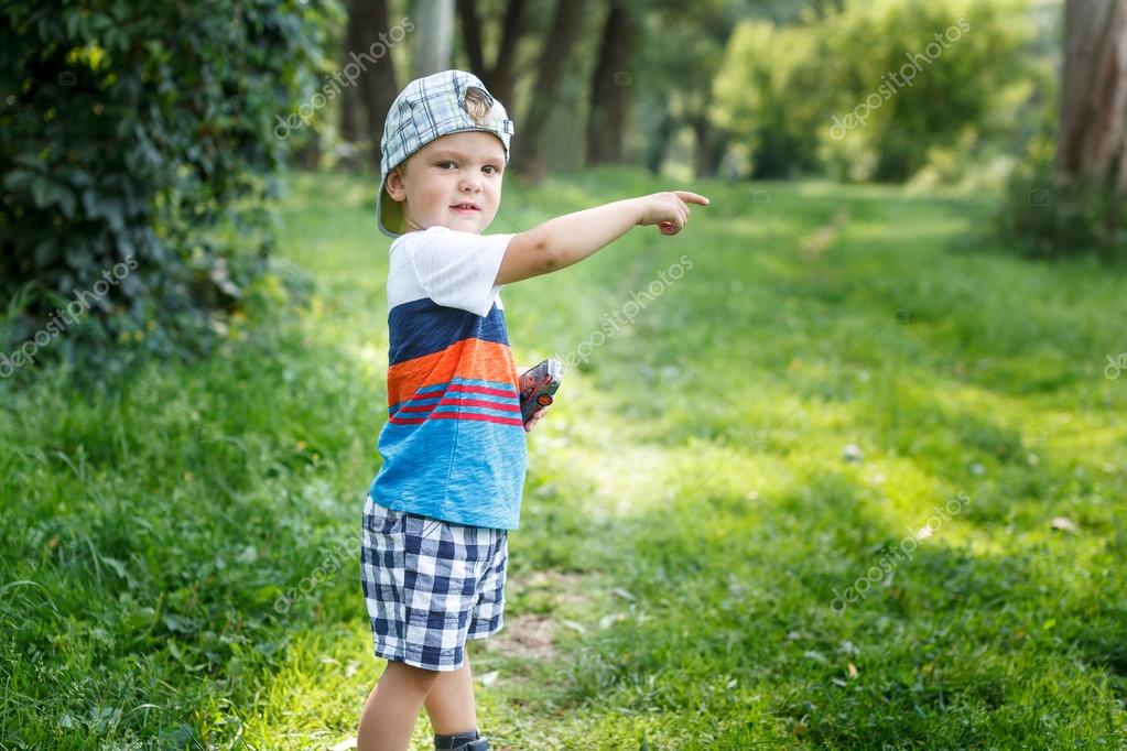Adorable little boy pointing at something Stock Photo by ©miroha141 ...