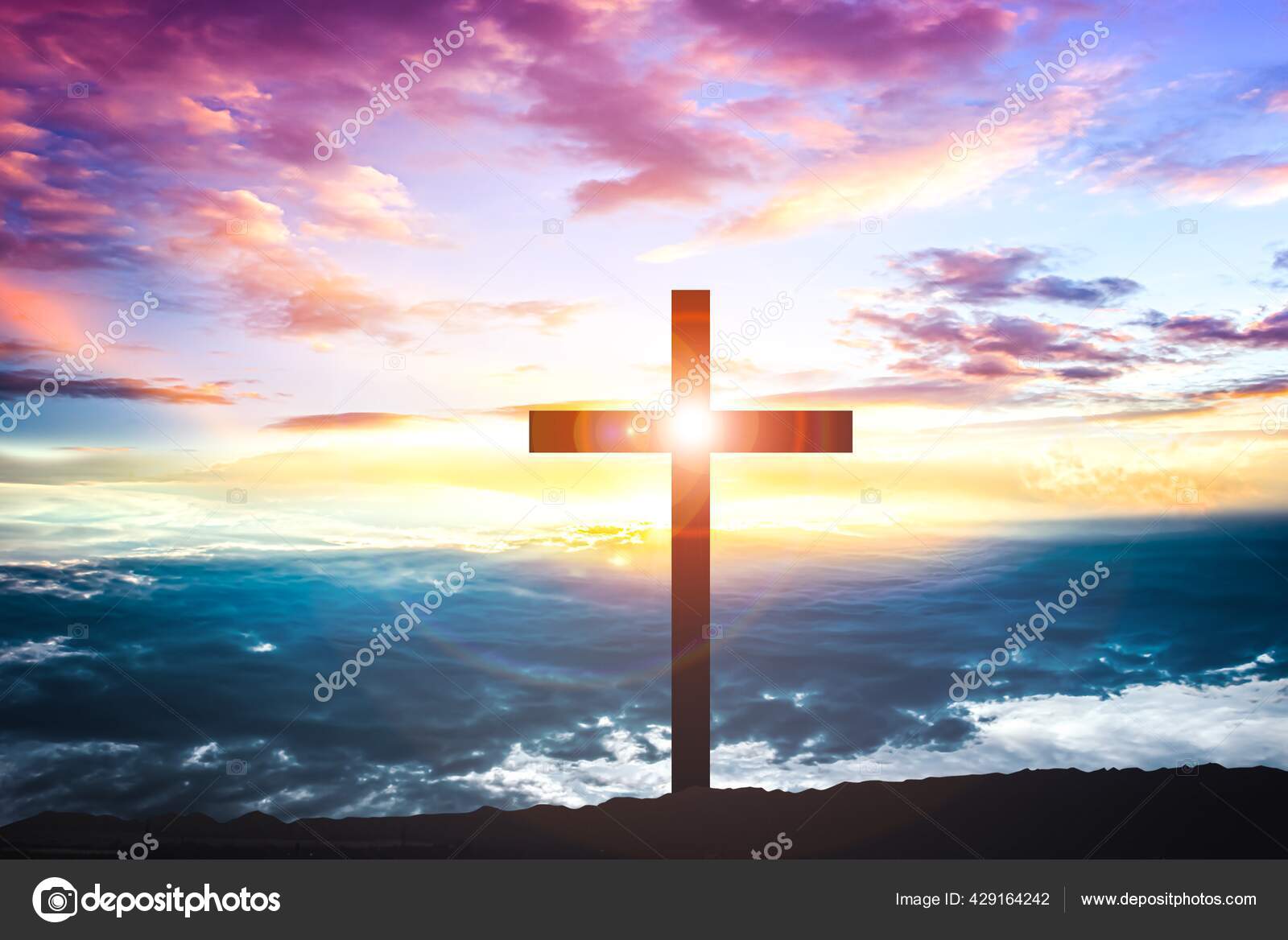 Cross With Sun In Background