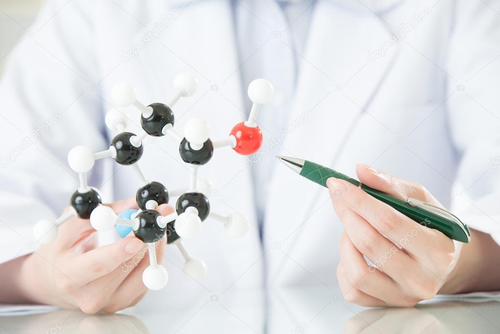 Asian female scientist teacher point at molecular model explain — Stock ...