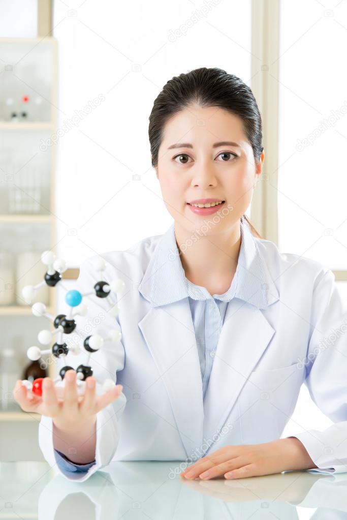 Asian female scientist teacher point at molecular model explain — Stock ...
