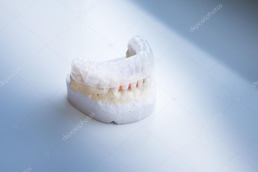Invisalign, invisible plastic teeth aligner Stock Photo by ©zlikovec ...