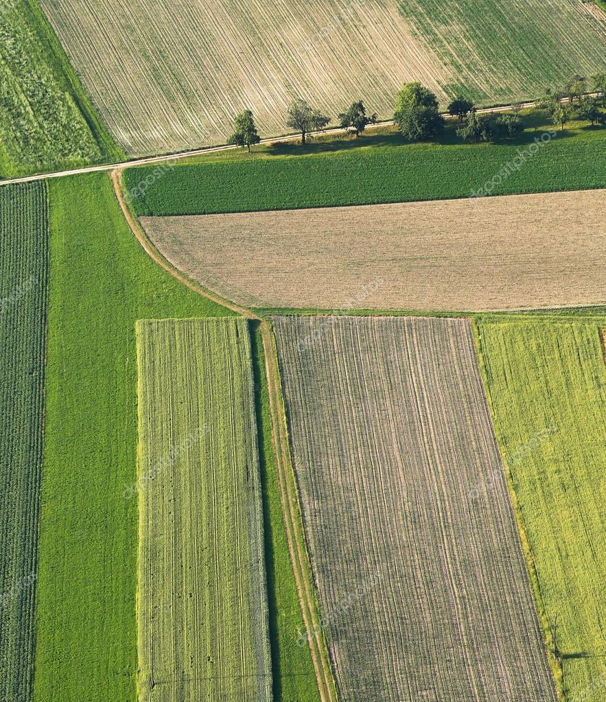 Freshly plowed and sowed farming land from above ⬇ Stock Photo, Image ...