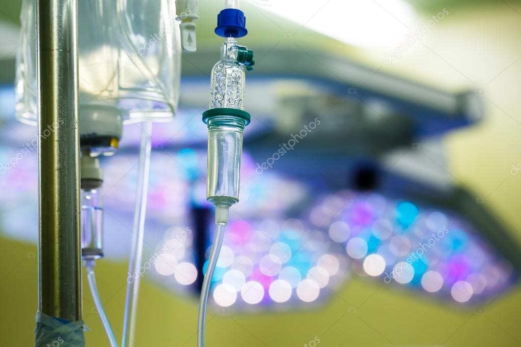 IV drip hanging on a pole in hospital — Stock Photo © zlikovec #82562722