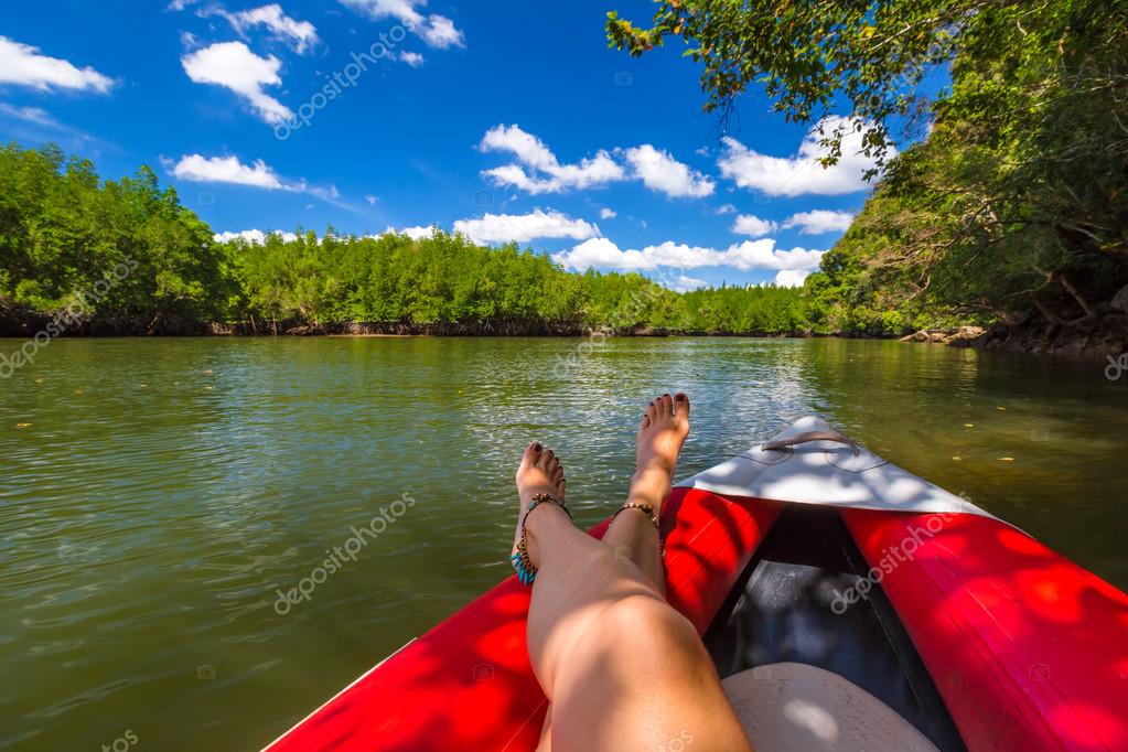 Tanned legs on kayak — Stock Photo © bennymarty #99857976