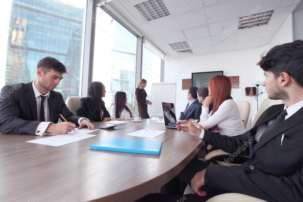 Business presntation on meeting of diverse people around the table ...