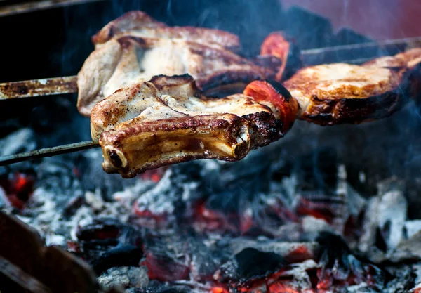 Bacon meat on bbq barbecue grill with fire — Stock Photo © lvenks #25218995