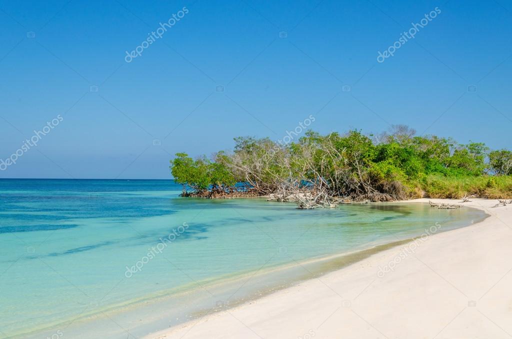 Beach with gold sand and blue sky — Stock Photo © ankamonika #72836357