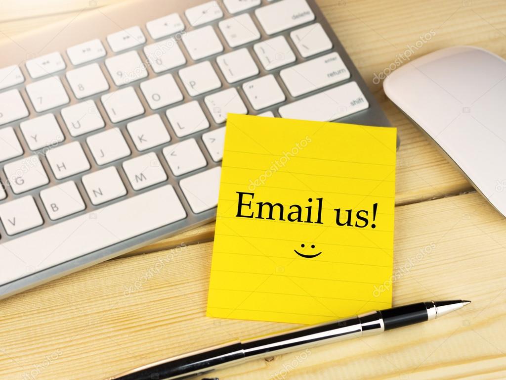 Email us on sticky note on work desk — Stock Photo © paikong #119771484