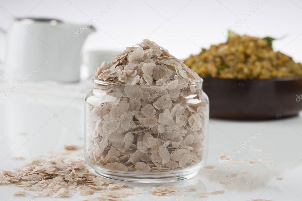 Raw poha or Aval placed with Aval upma or poha upma or kanda poha upma ...