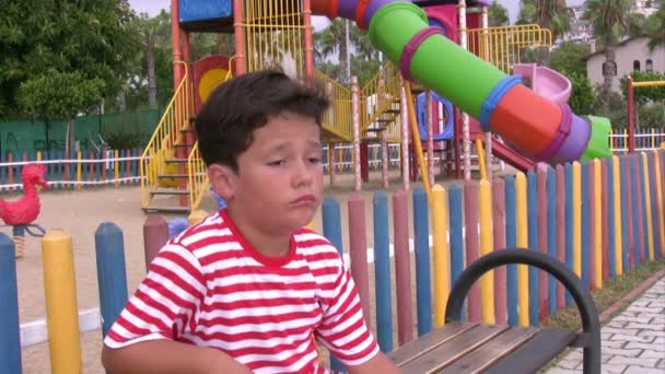 Sad child in the playground — Stock Video © DerinMedia #73865331