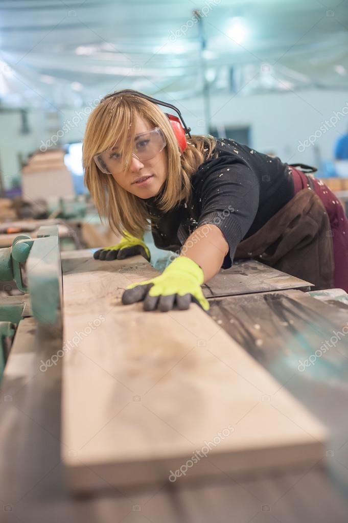 Female carpenter Using Electric Sander Stock Photo by ©guruxox 101222780