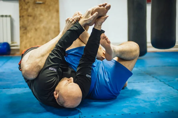 BJJ Jiu-jitsu brasileño combate terrestre entrenamiento combate moderado. Técnica de control de ...