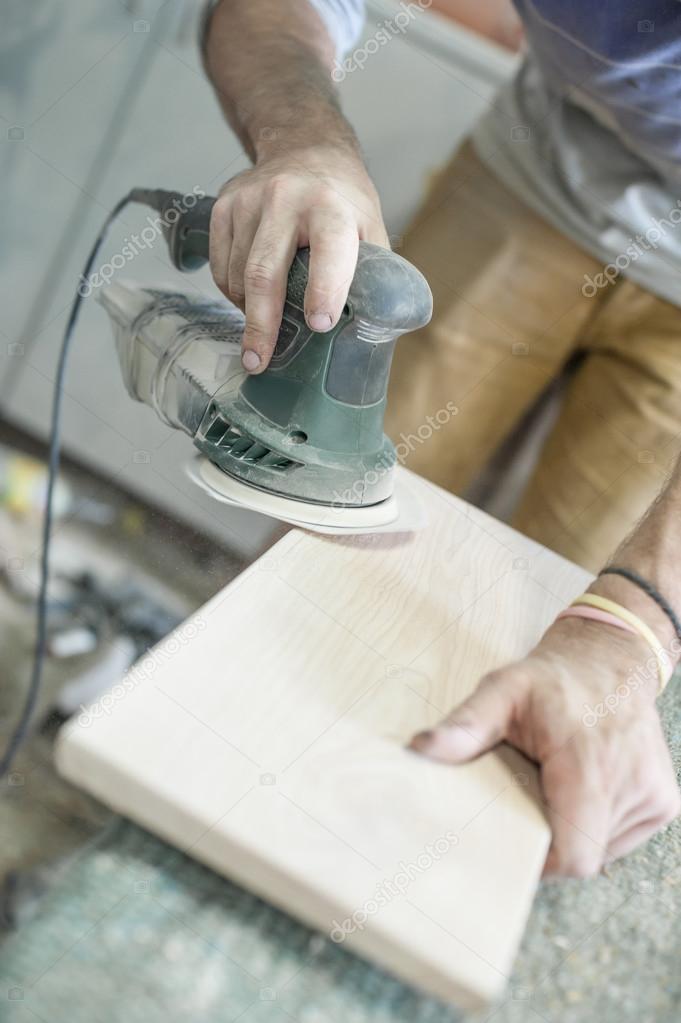 Carpenter Using Electric Sander Stock Photo by ©guruxox 84611312