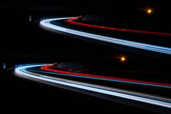 Night road lights. Lights of moving cars at night. long exposure red ...