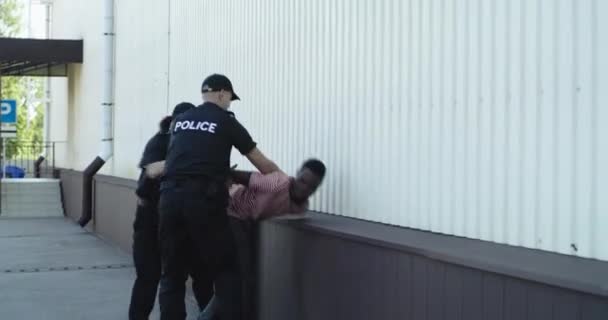 Black man running away from police officers Stock Video Footage by ...