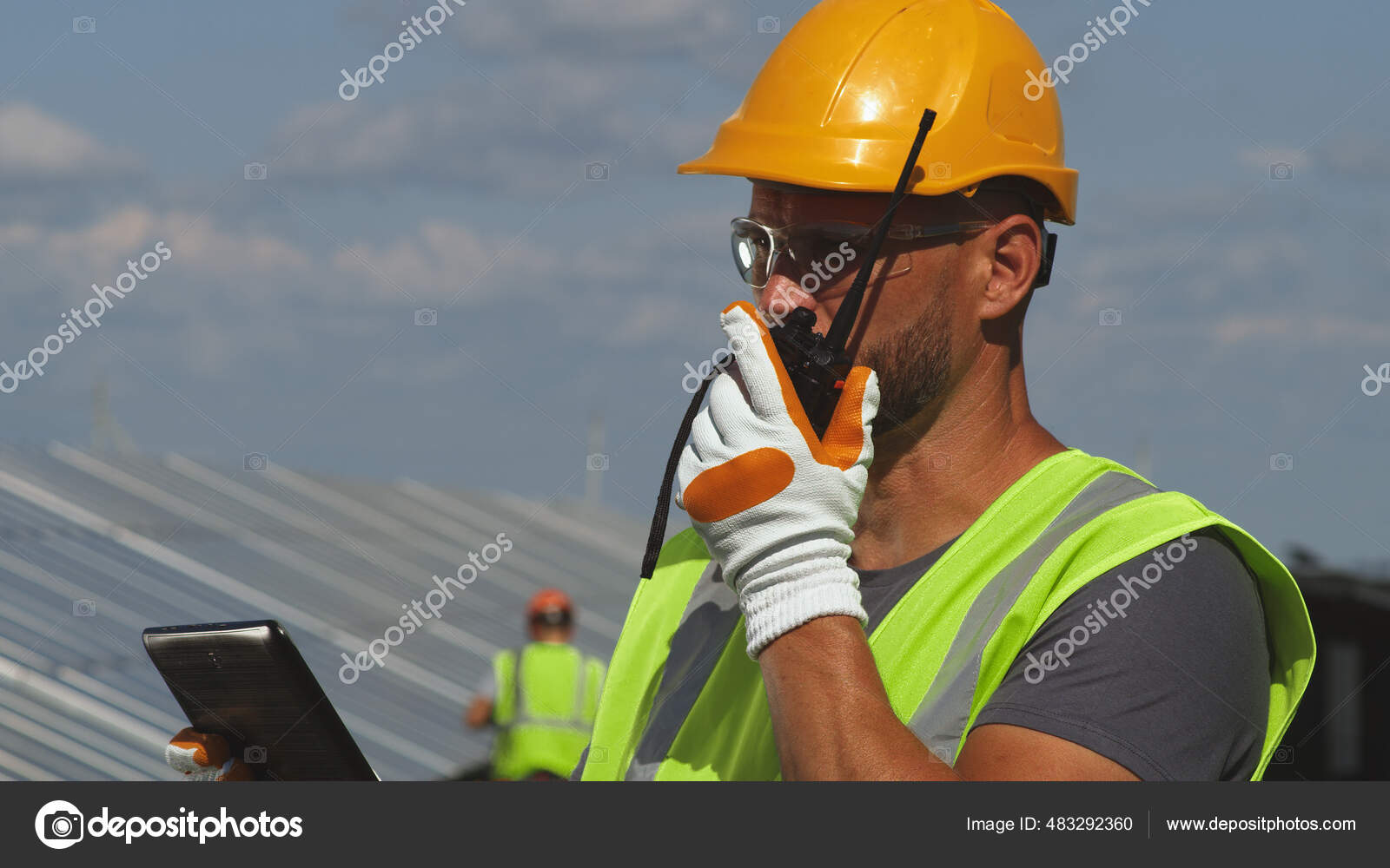 Solar farm engineer giving instructions on radio — Stock Photo ...