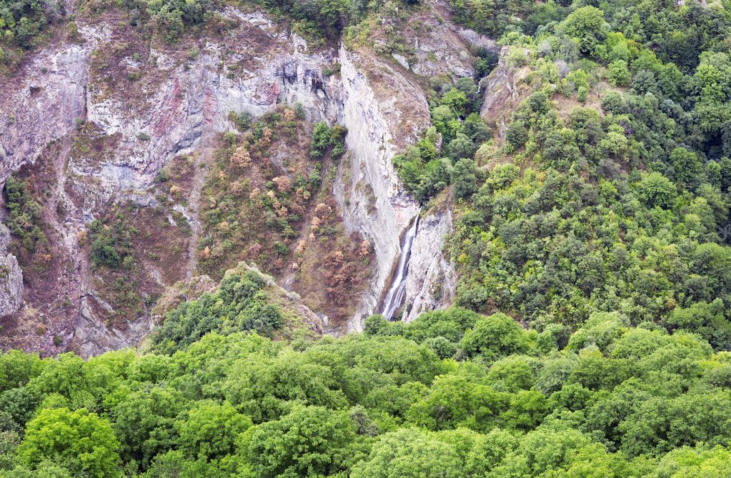 Mountain landscape waterfall flows down the cliff. — Stock Photo ...