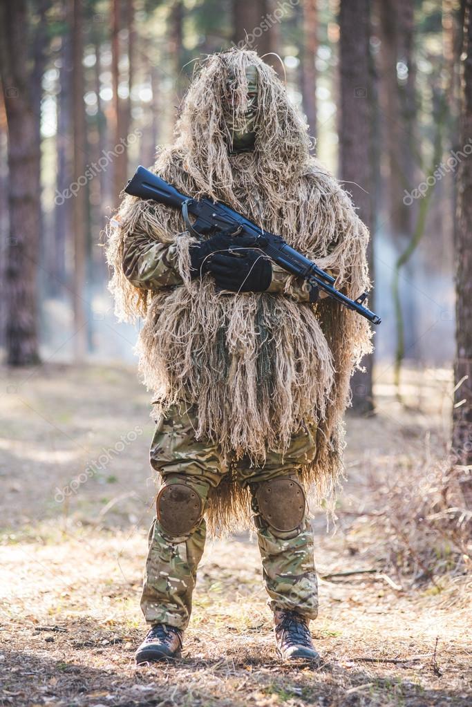 Sniper in camouflaged suit with rifle — Stock Photo © Nesterenko_Max ...