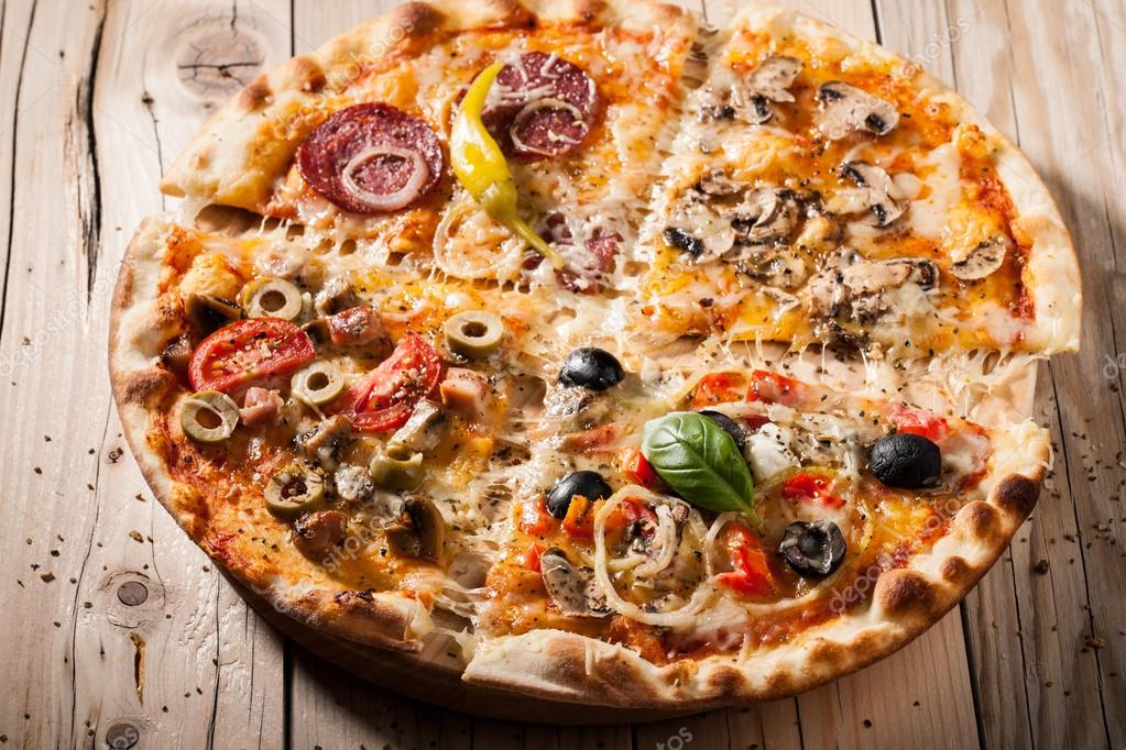 Mixed topping pizza — Stock Photo © ffphoto #82066408