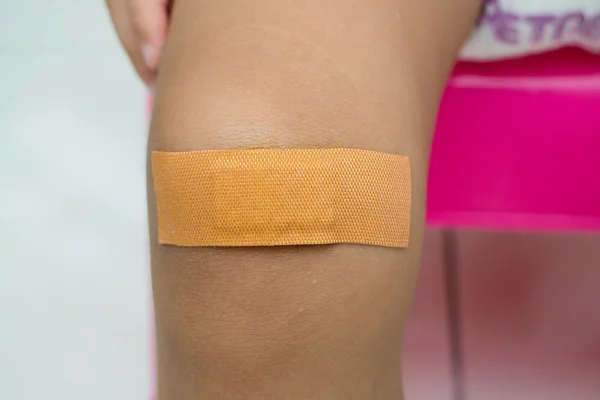 Child with Band Aid on Knee Stock Photo by ©kiankhoon 106368442