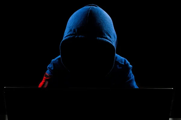 Faceless Hacker using computer Stock Photo by ©kiankhoon 81207336