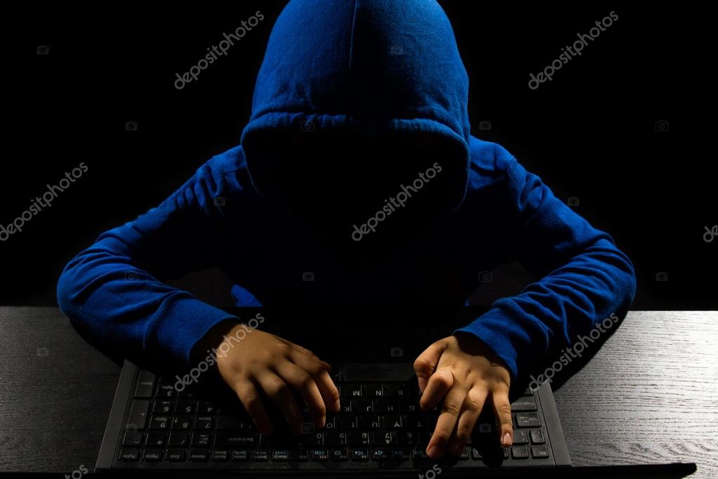Faceless Hacker using computer Stock Photo by ©kiankhoon 81207336