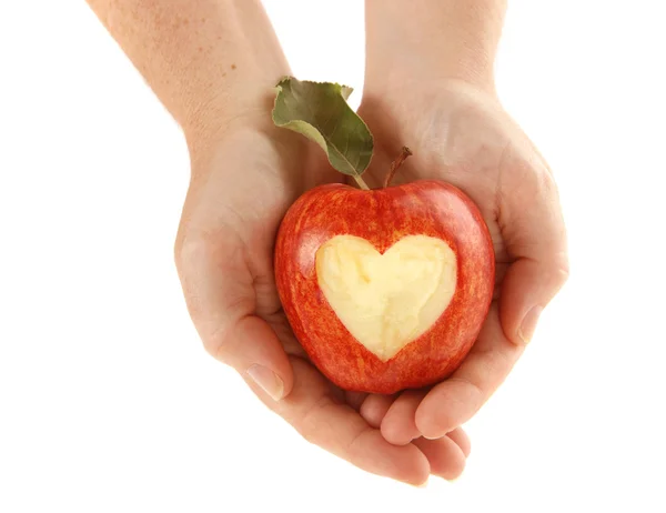 Apple with heart in female hands Stock Photo by ©belchonock 90732700