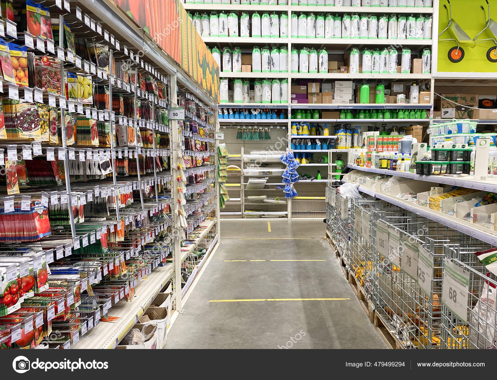 Seed and fertilizer shop. Racks with packaging seeds and fertilizers ...