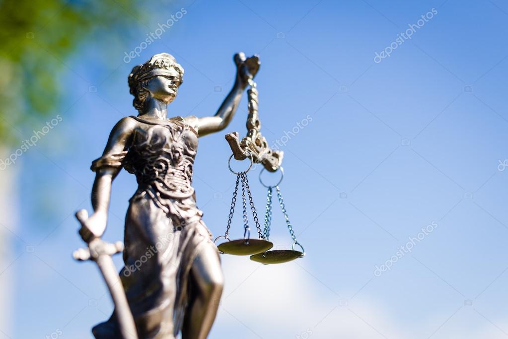 Sculpture of themis, femida or justice goddess on bright blue sky ...