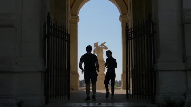 People Walking Arched Passageway — Stock Video © ATWStock #475145516