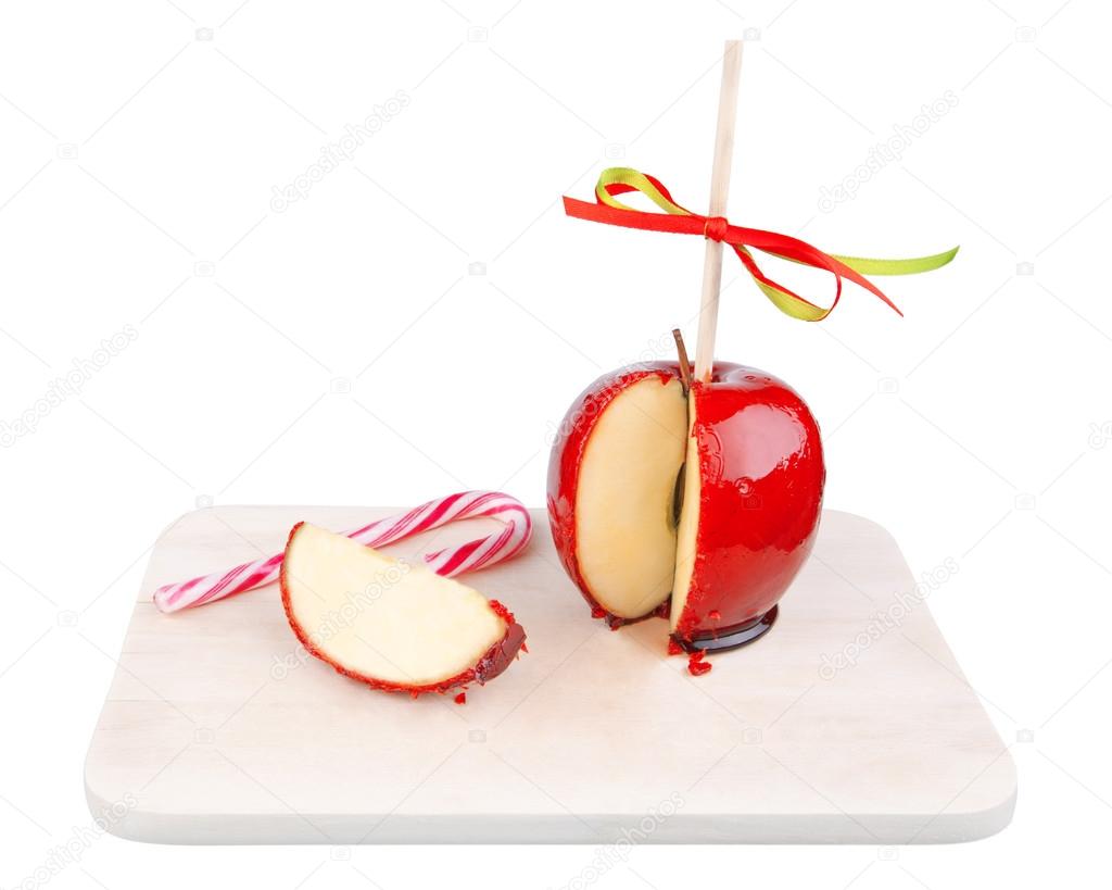Candied apple with a candy cane Stock Photo by ©pixelliebe 74911305