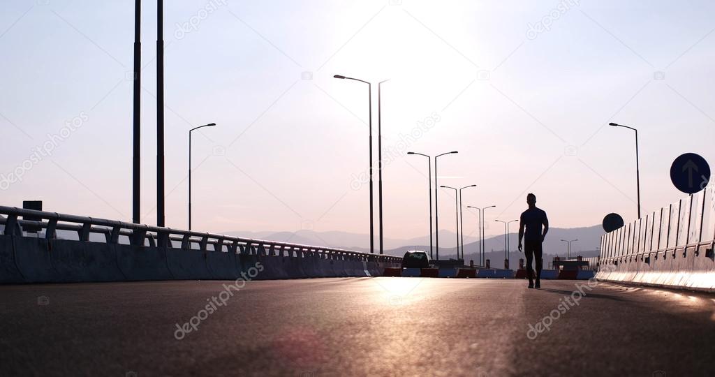 Man walking at sunset Stock Photo by ©Myvisuals 112655032