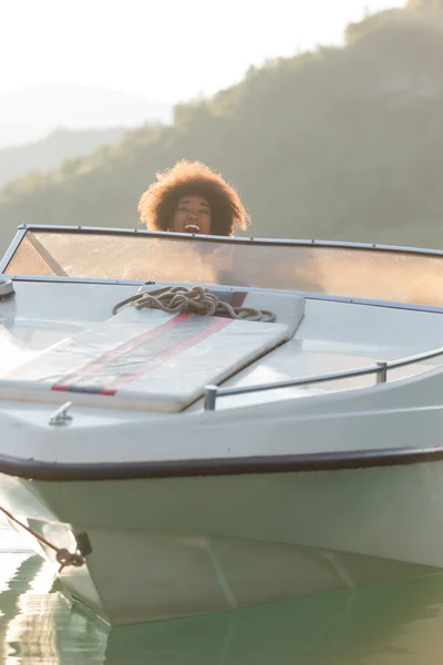 Woman driving a motor boat - Stock Image - Everypixel