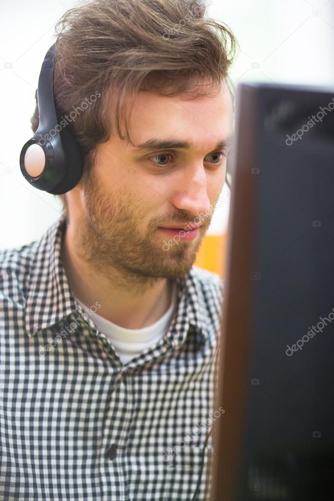 Friendly telephone operator smiling during a telephone conversat ...