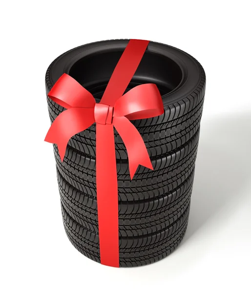 Gift set of tires wrapped ribbon and bow isolated — Stock Photo ...