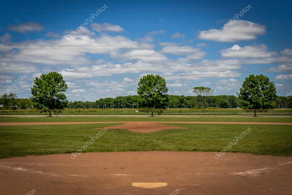 Baseball Field with Blue Sky and Clouds — Stock Photo © amcimages #78085526