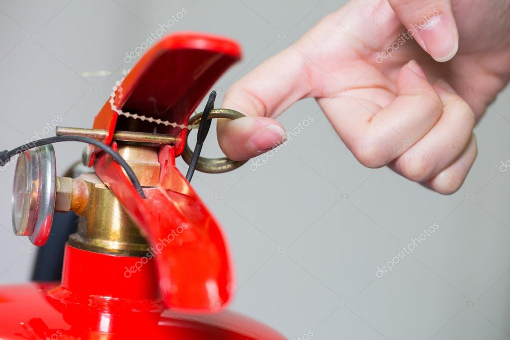 Close- up Fire extinguisher and pulling pin on red tank. Stock Photo by ...