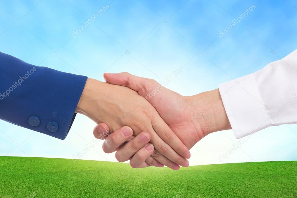 Handshake communication on landscape view background. Stock Photo by ...