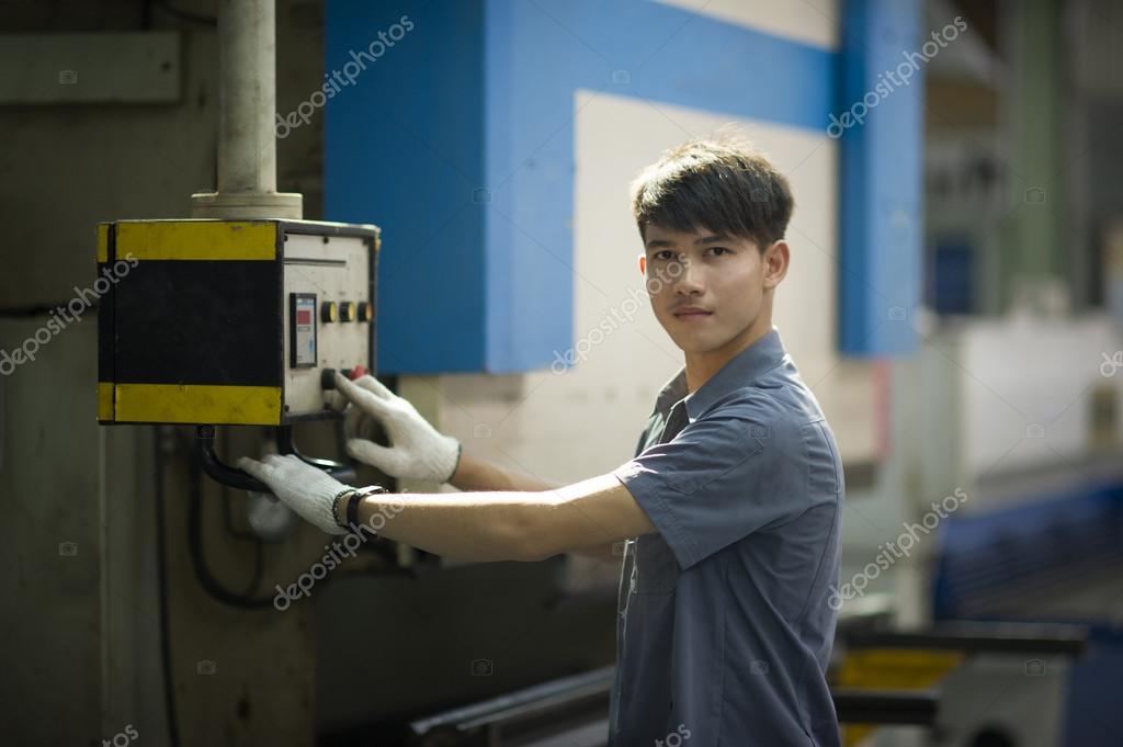 Man controlling hydraulic Press brake Stock Photo by ©wichansumalee ...