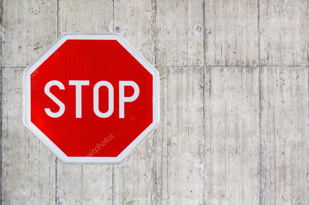 Red stop sign on a concrete wall — Stock Photo © Bennian #96033798