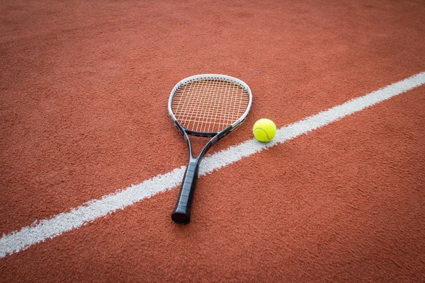 Tennis racket and ball on court - Stock Image - Everypixel