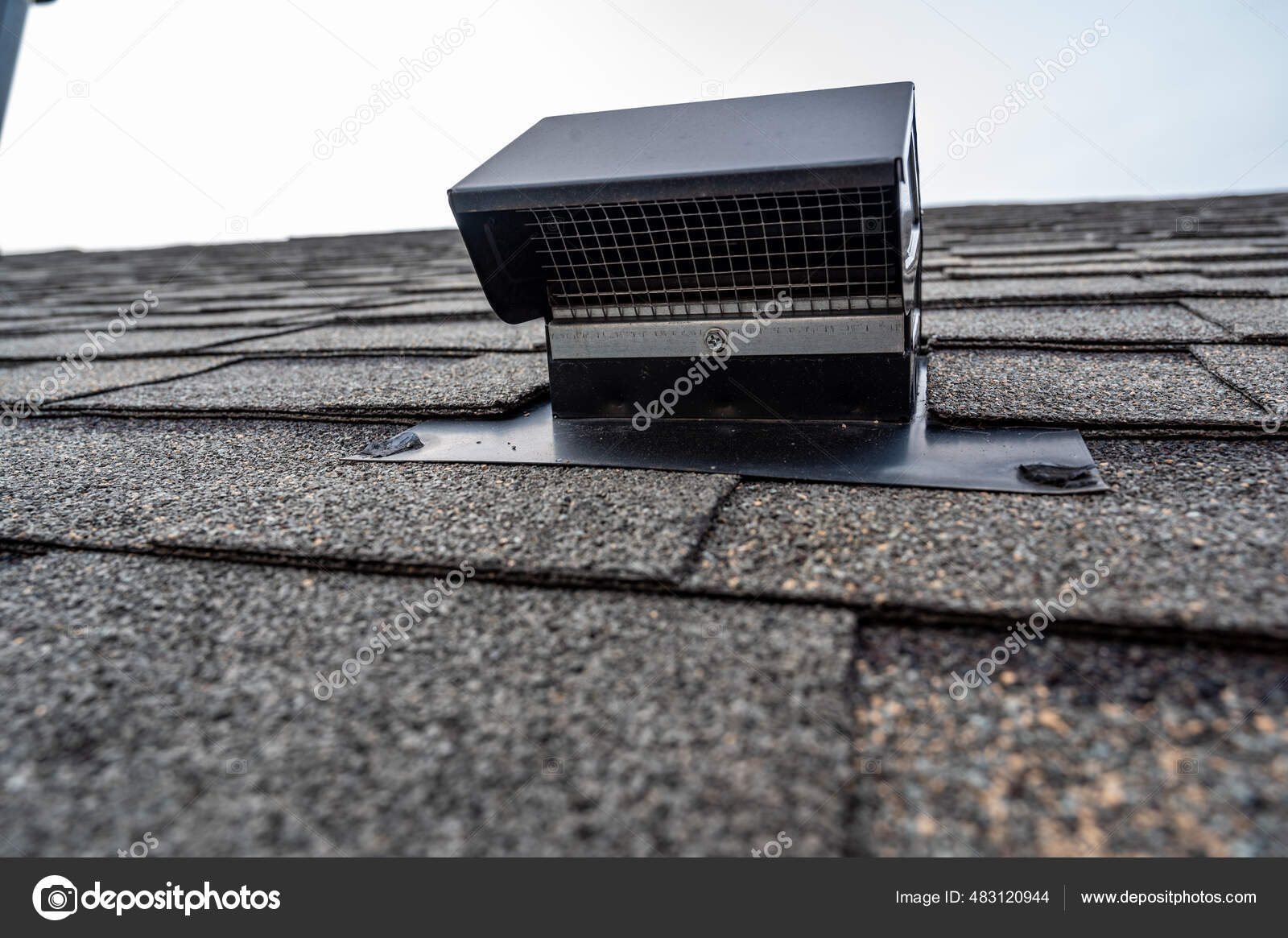 Static vent installed on a shingle roof for passive attic ventilation ...