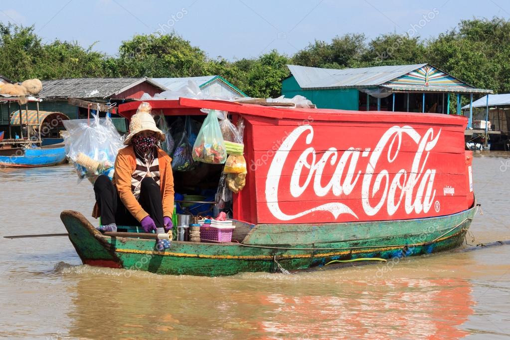 Coca Cola logo painted on wooden boat, floating village, Cambodia ...