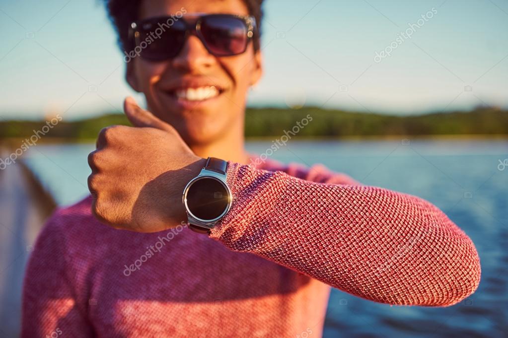 Boy wearing trendy smart watch Stock Photo by ©kegfire 121660732
