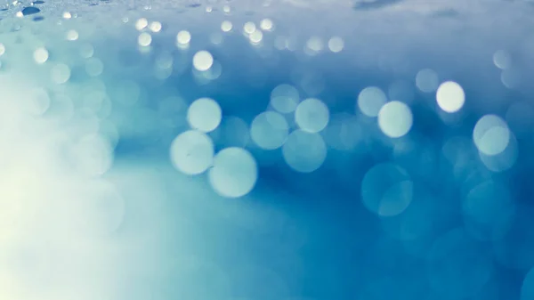 Blue bokeh particles glitter awards dust gradient abstract background. Futuristic glittering in ...