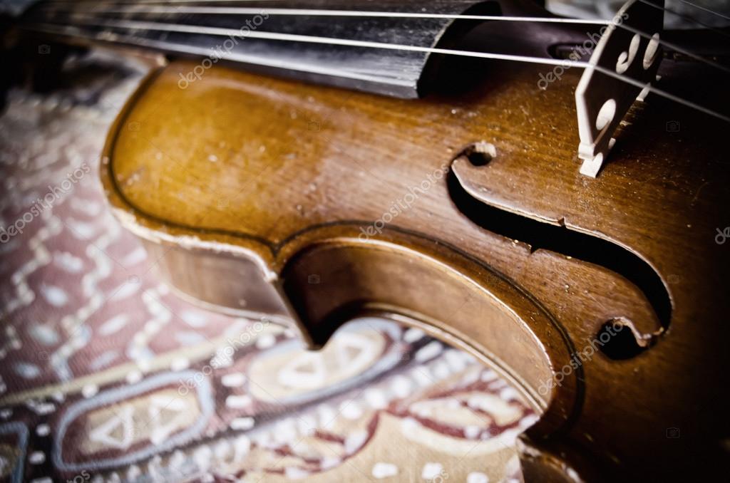 Still life with vintage violin. Closeup of old wooden violin. Stringed ...